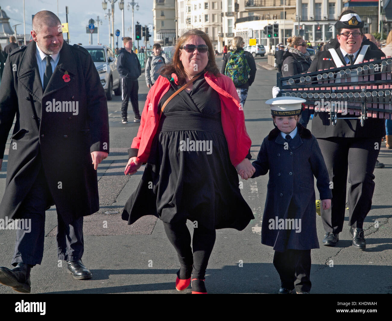 A young sea cadet with her family at the Remembrance Day parade on ...