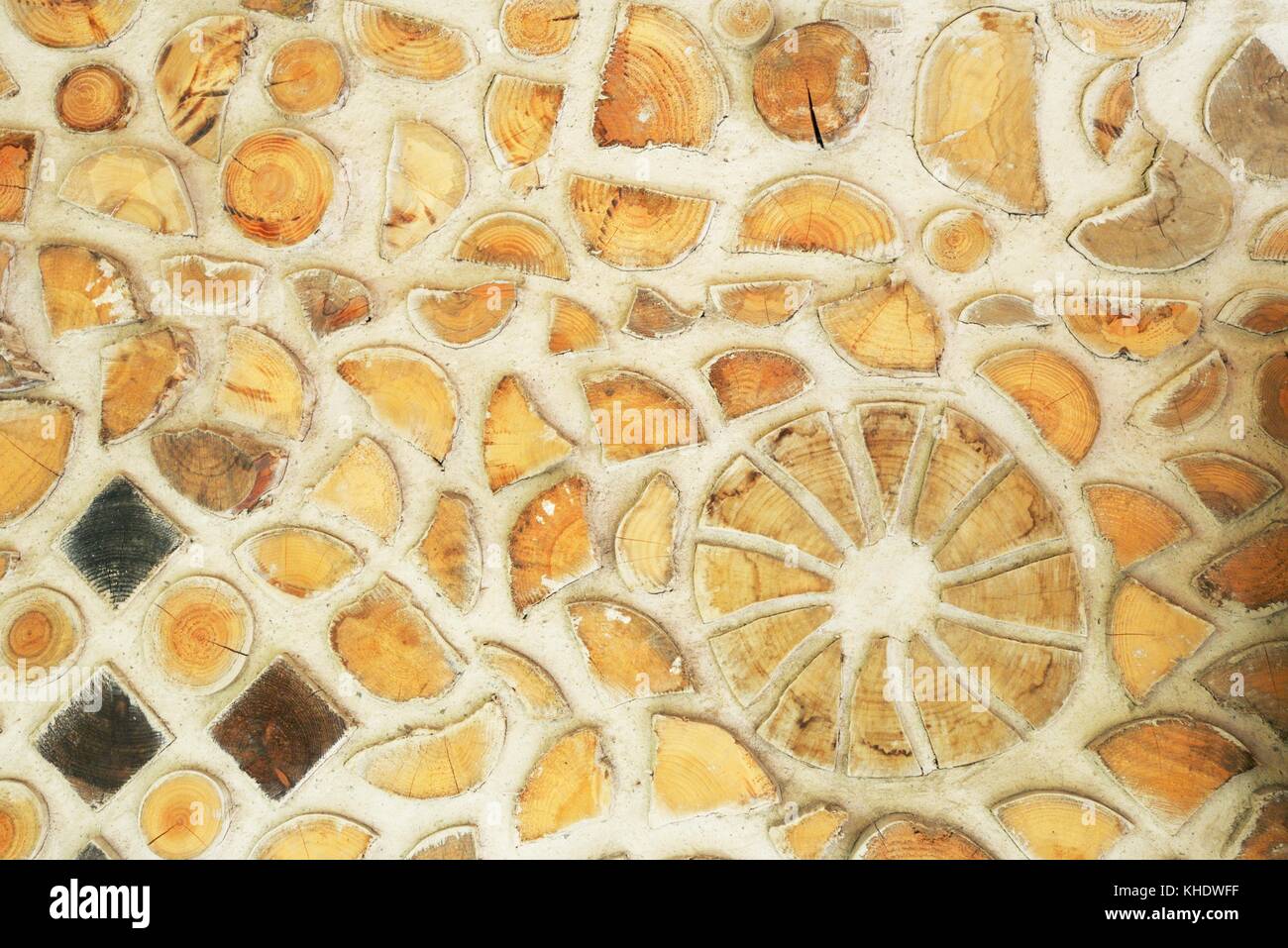 Cordwood or Cobwood wall construction, cleft or split timber in a ...