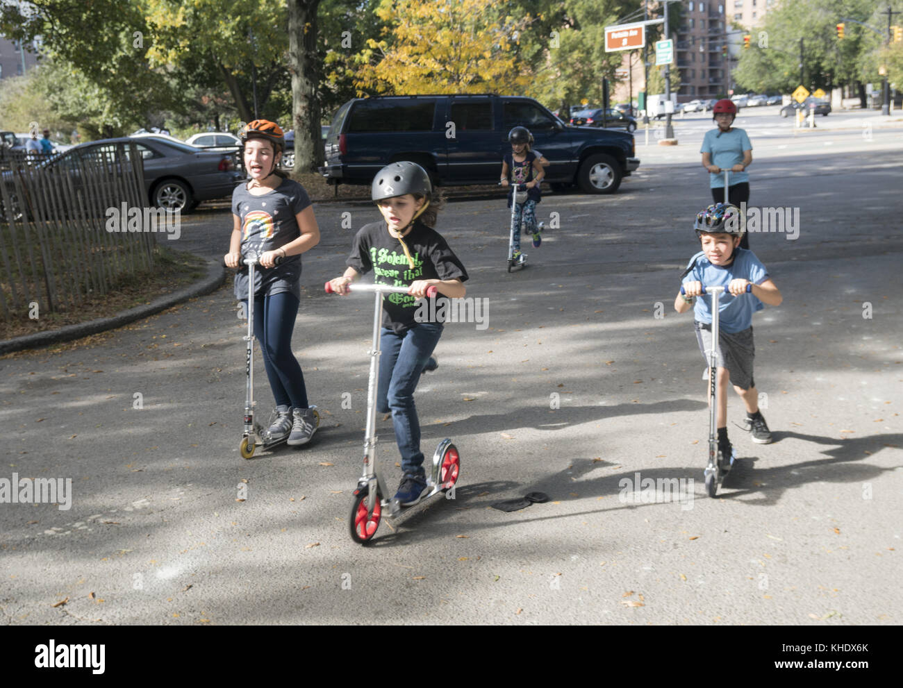 Children riding scooters through the Parade Grounds by Prospect Park ...
