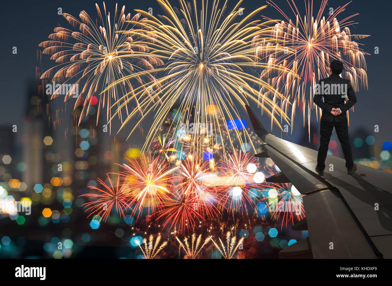 businessman standing on airplane wing which can see Fantastic festive ...