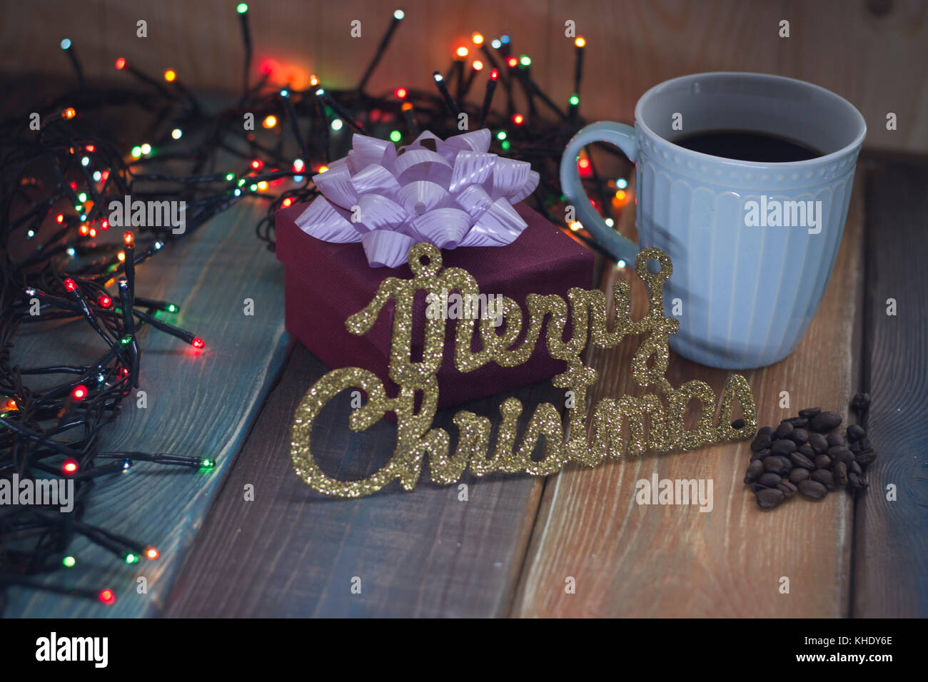 A gift, a gold inscription and a cup of coffee on the table Stock Photo ...