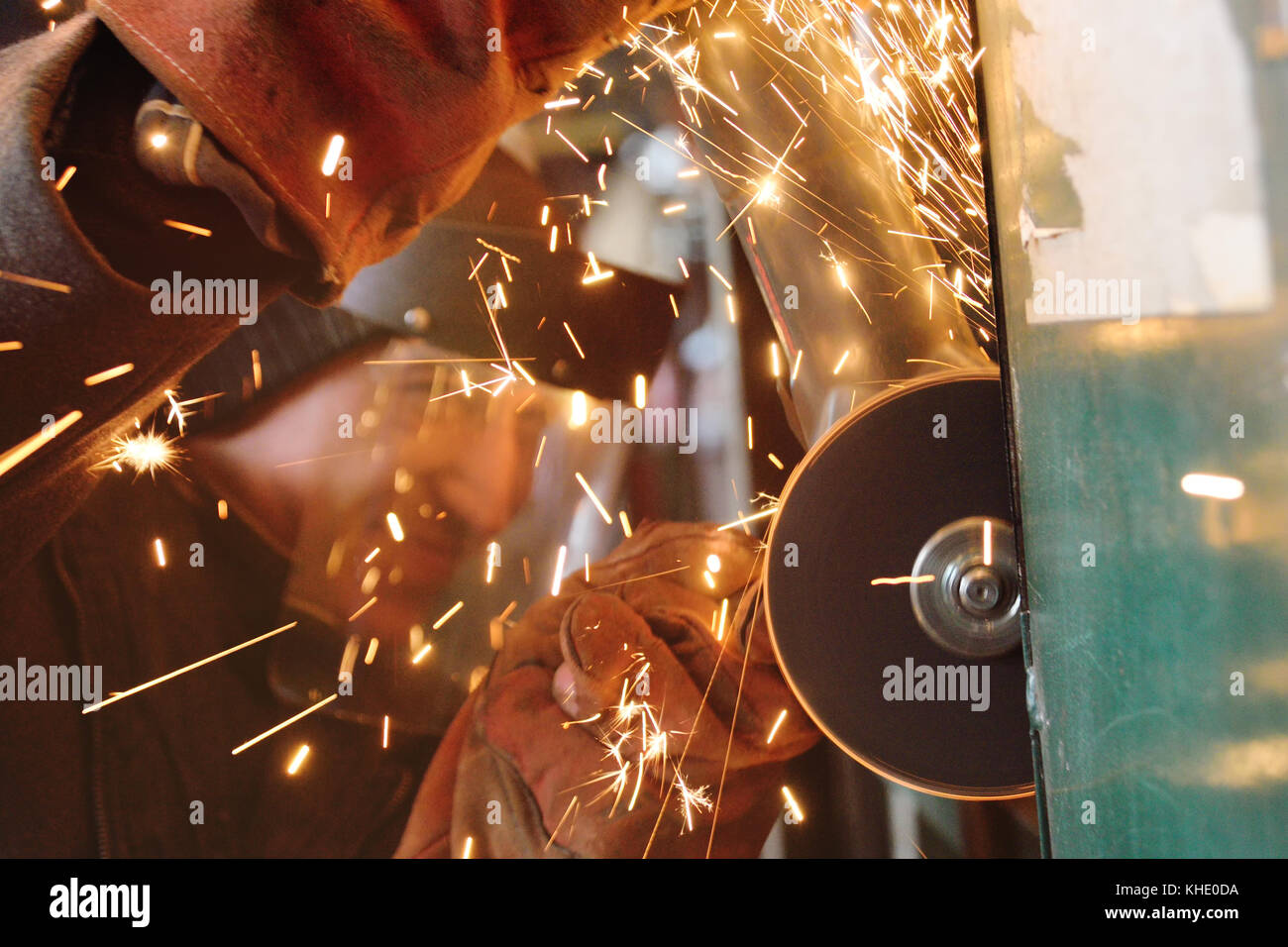 Worker with angle grinder Stock Photo - Alamy