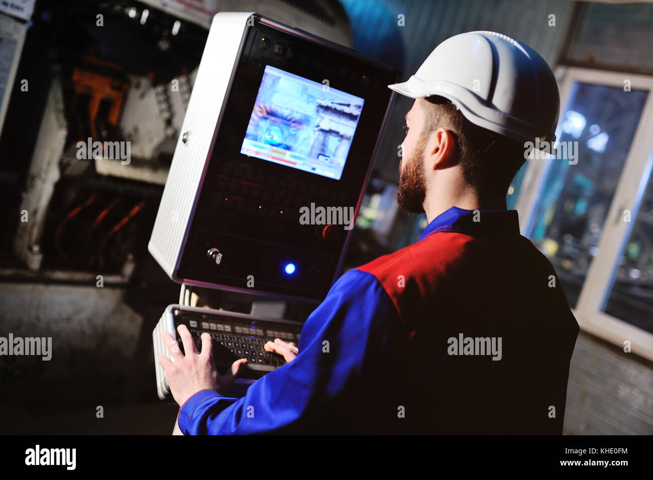 Man working behind the control panel in the cockpit of the plant Stock ...