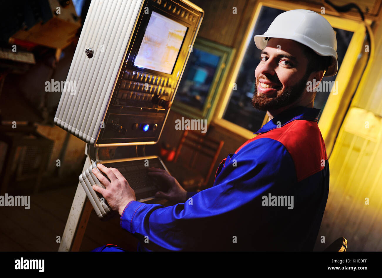 Man working behind the control panel in the cockpit of the plant Stock ...