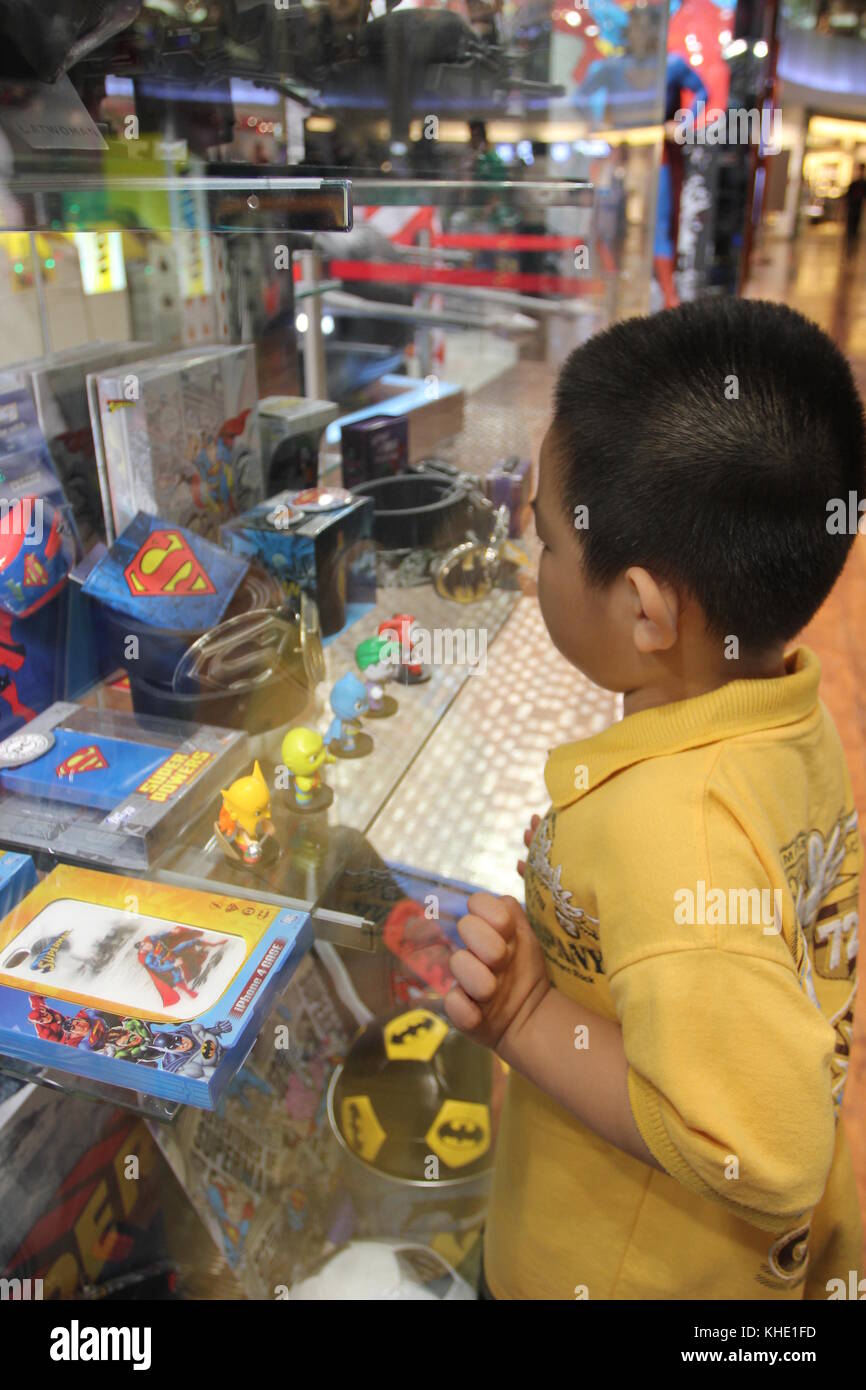 boy looking at toy display Stock Photo - Alamy