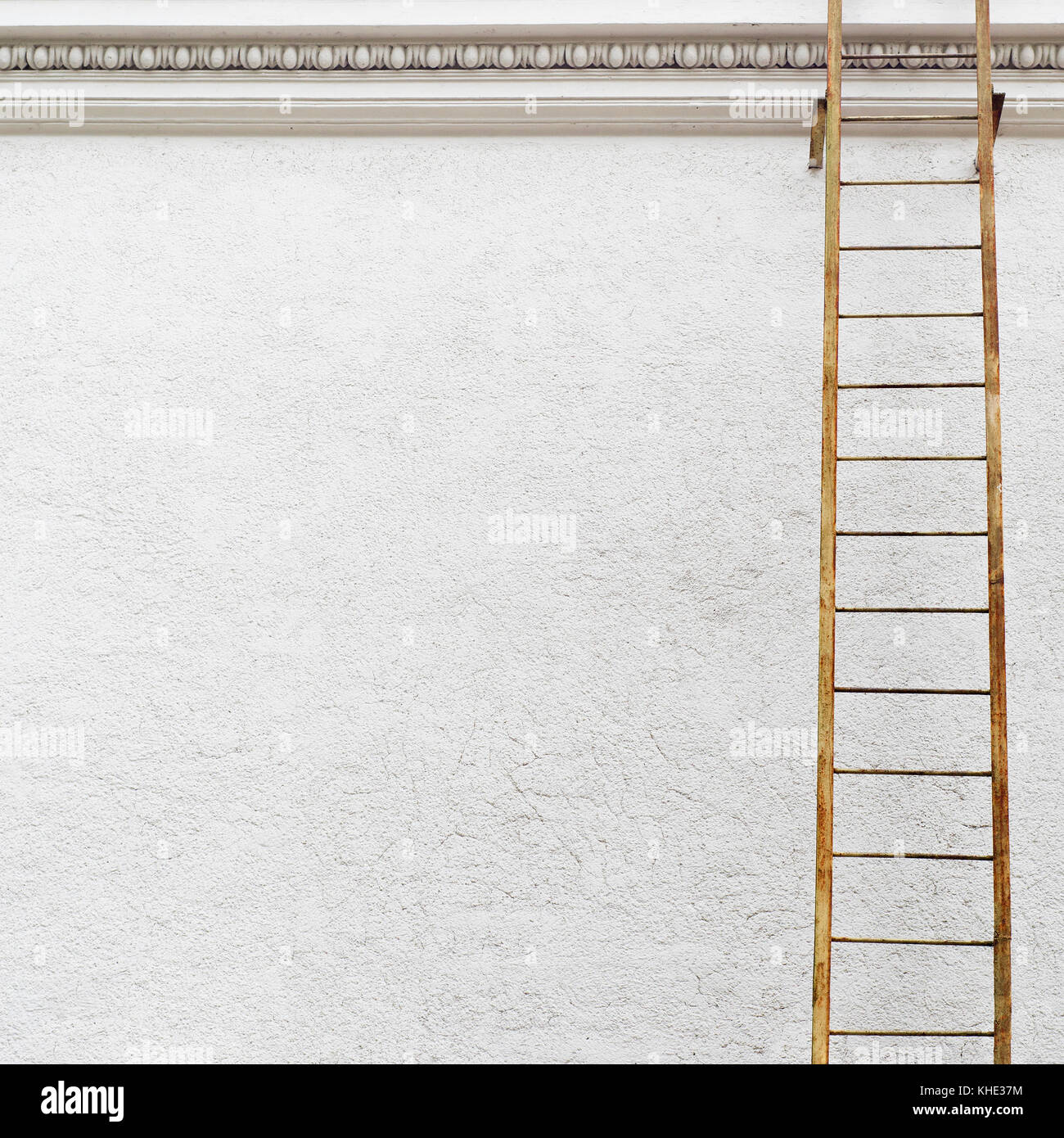 White stucco wall with metal ladder Stock Photo - Alamy