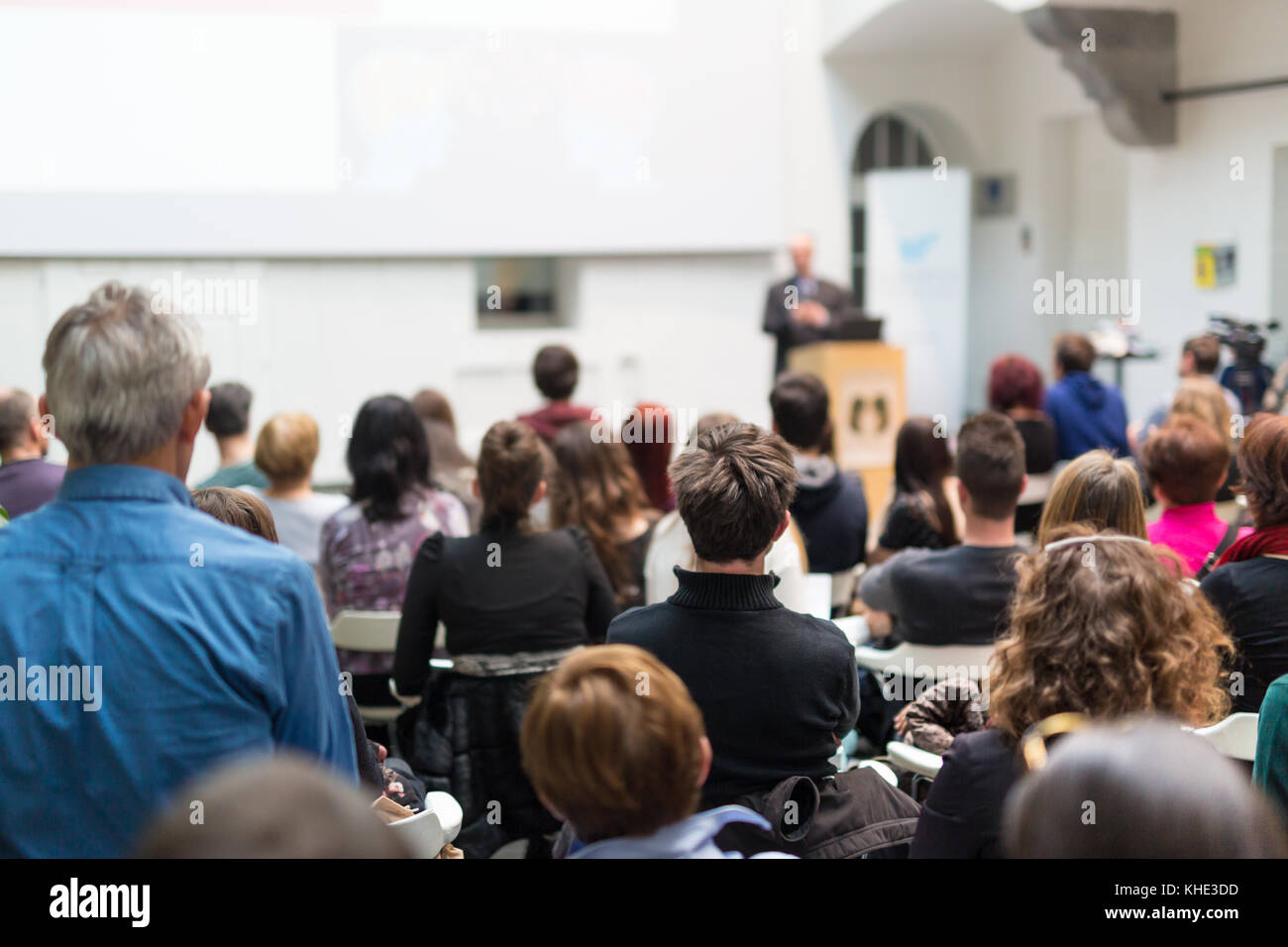 Man giving presentation in lecture hall at university Stock Photo - Alamy
