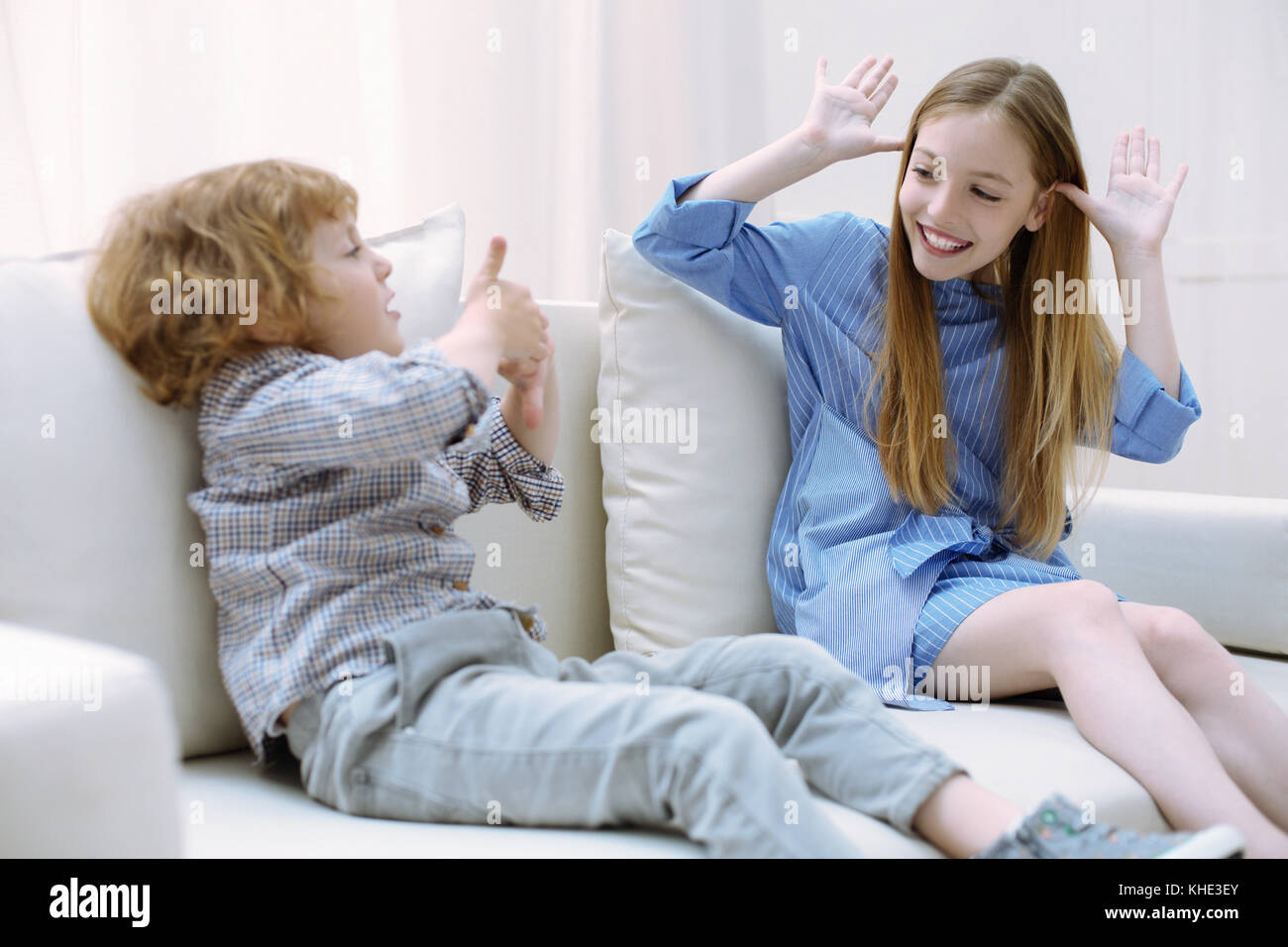 Two cheerful children having fun together Stock Photo - Alamy