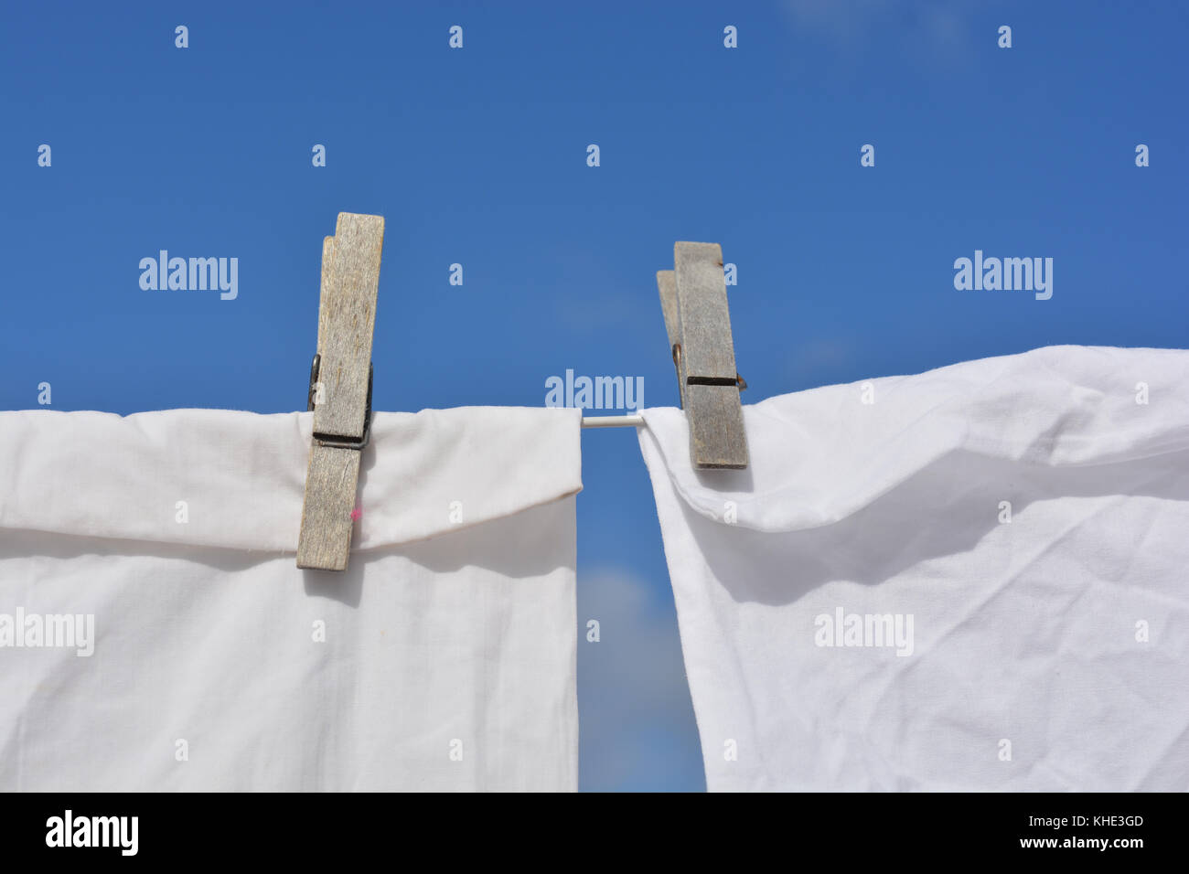 Laundry day. White washing hanging on the line drying in the sun Stock ...