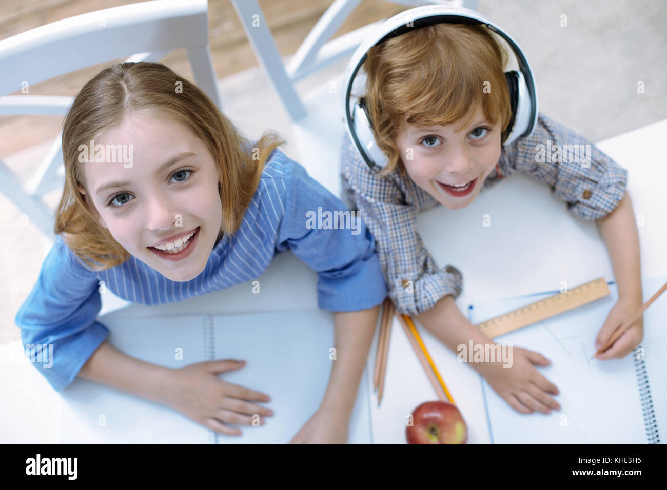 Funny smiling children doing their interesting homework Stock Photo - Alamy