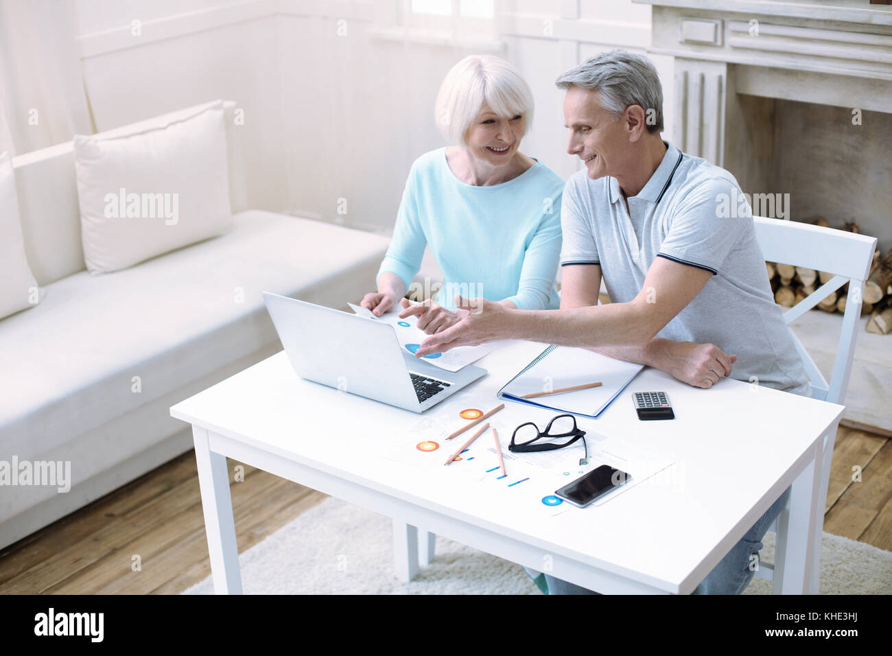 Helpful man sitting with his active wife Stock Photo - Alamy