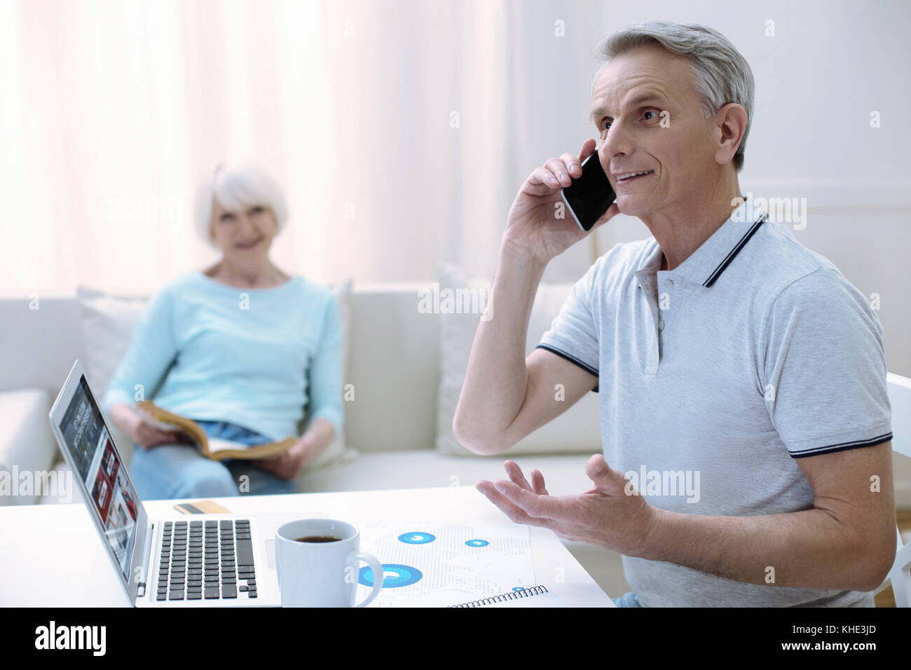 Positive senior man talking on the phone and smiling Stock Photo - Alamy