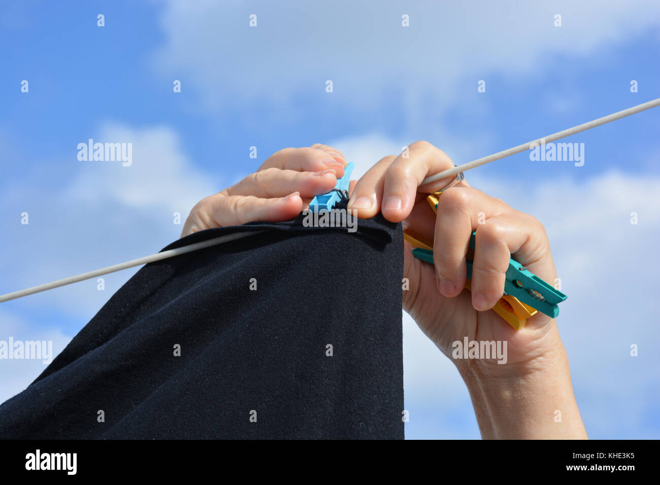 Laundry day. Hanging out the washing on a clothes line outdoors Stock ...