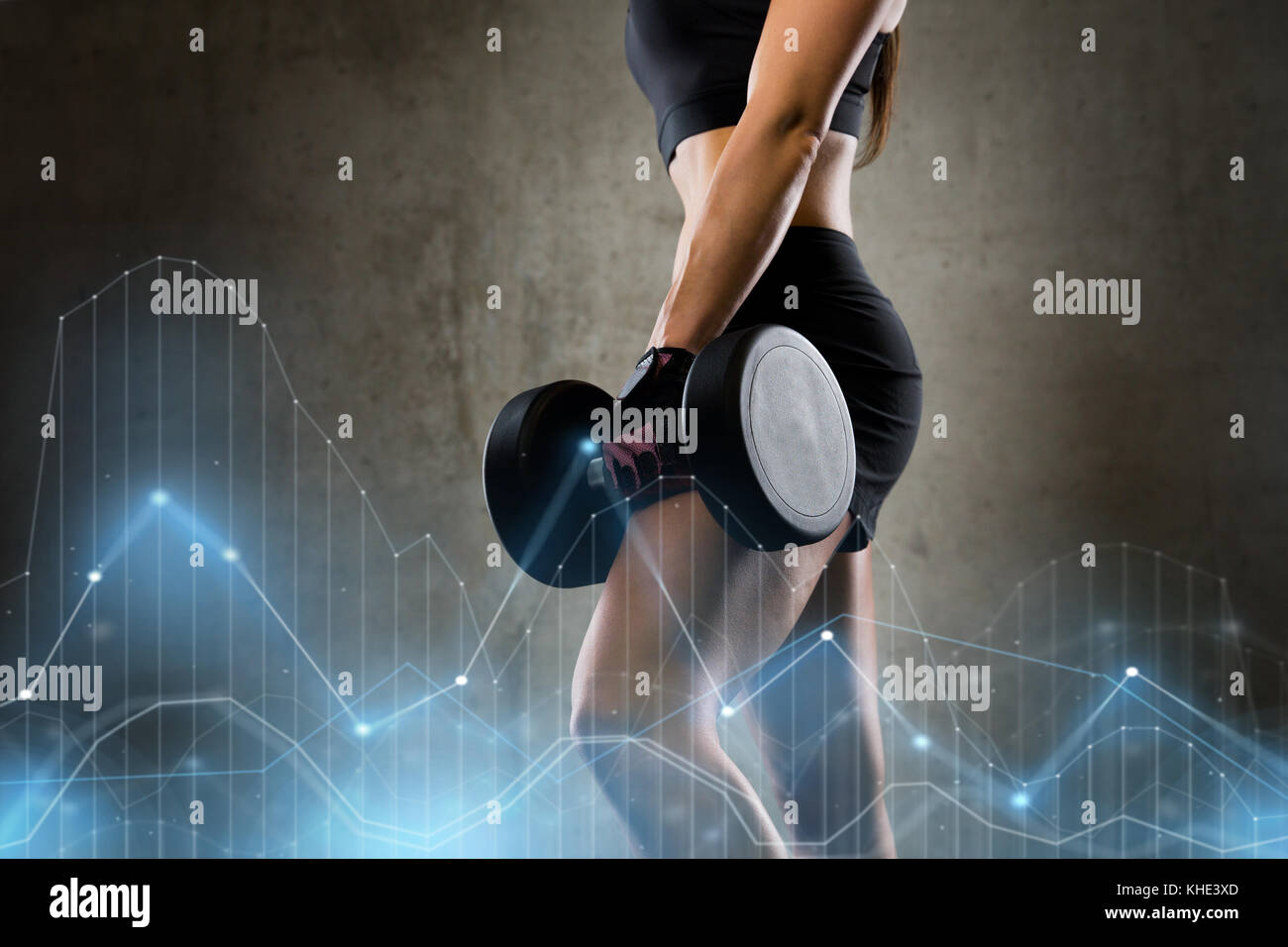 woman with dumbbell in gym Stock Photo - Alamy