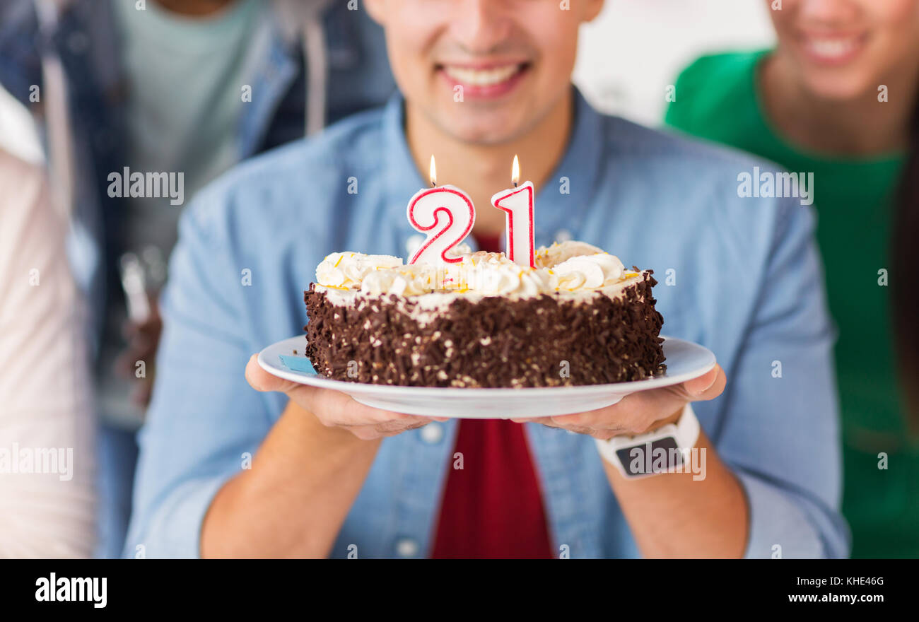 man with cake and friends at birthday party Stock Photo - Alamy