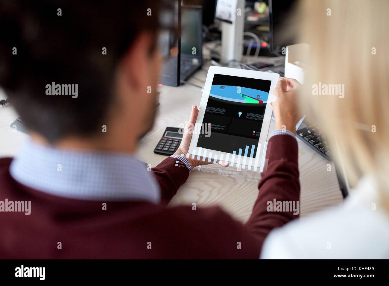Tablet computer showing charts hi-res stock photography and images - Alamy