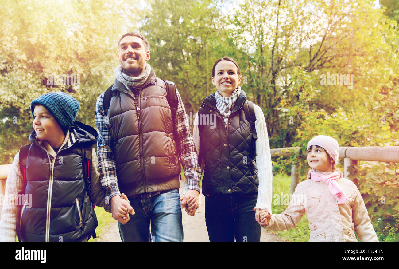 happy family with backpacks hiking Stock Photo - Alamy
