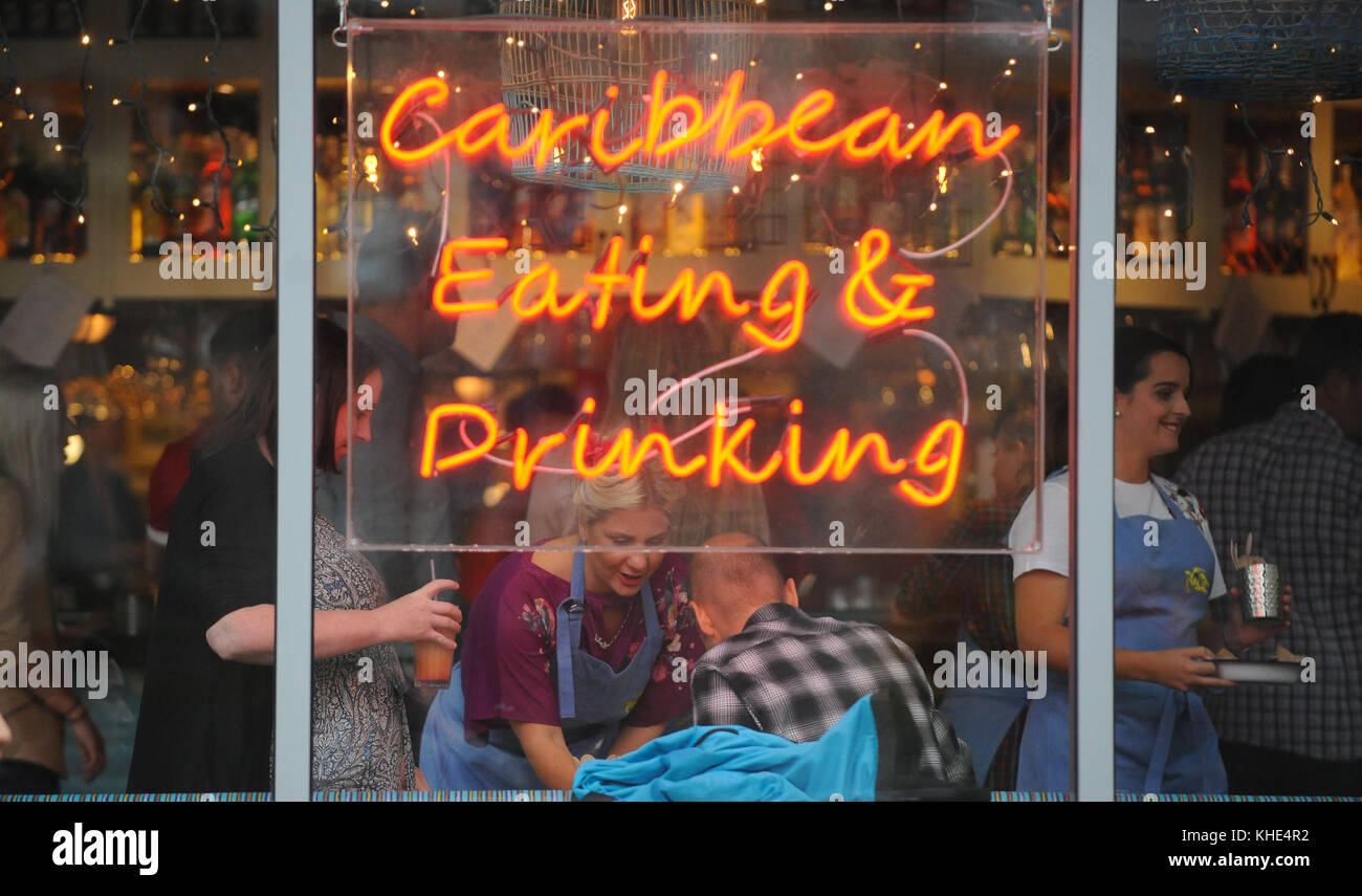 A light up sign promoting Caribbean eating and drinking at a Turlte Bay ...
