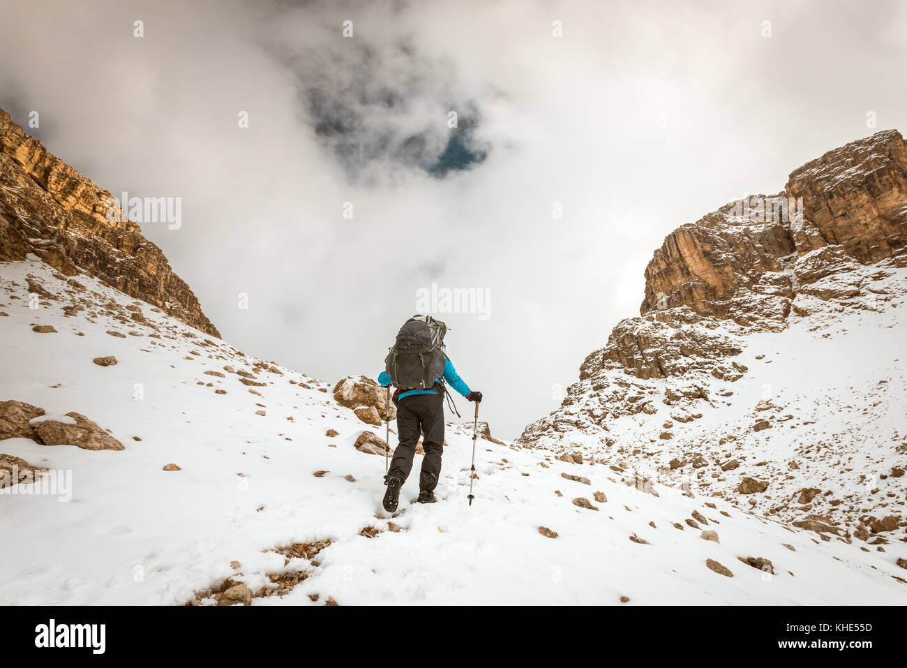 Tourist with backpack hiking in mountains Stock Photo - Alamy