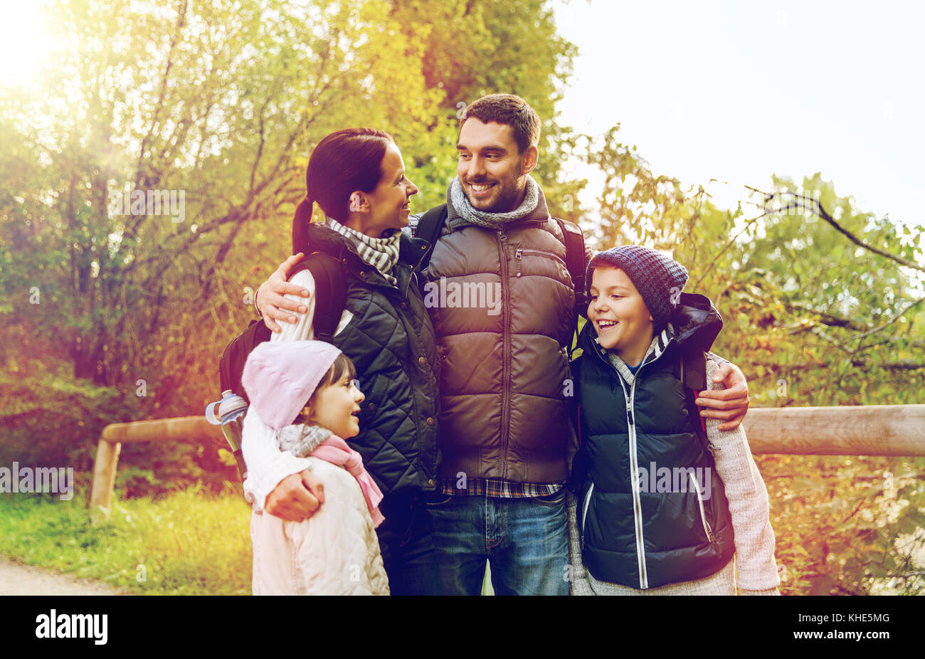 happy family with backpacks hiking Stock Photo - Alamy