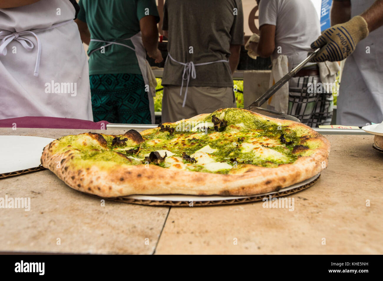 Timber Pizza Company co-owner Chris Brady slides an oven fresh bubbling ...