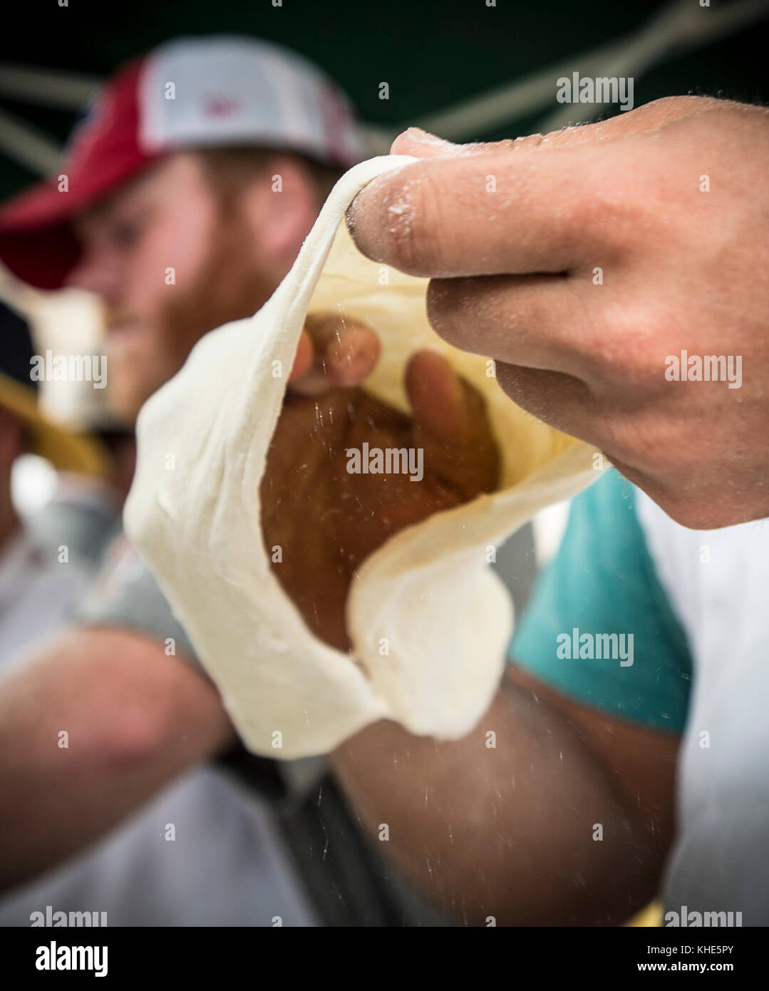 Timber Pizza Company co-owner Andrew Dana works the pizza dough at the ...