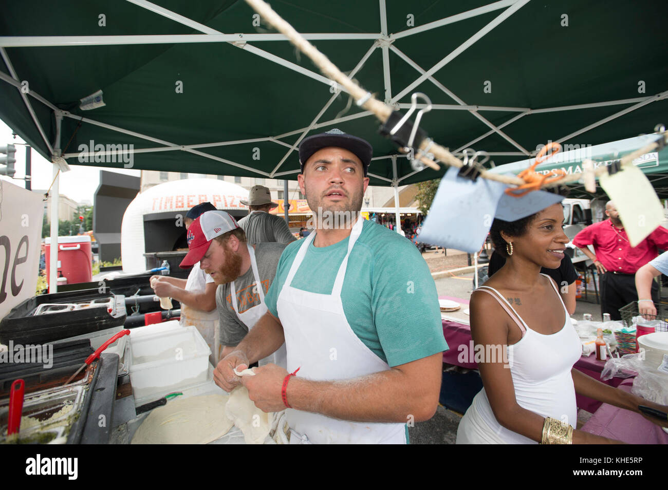From right, Timber Pizza Company co-owner Andrew Dana keeps an eye on ...