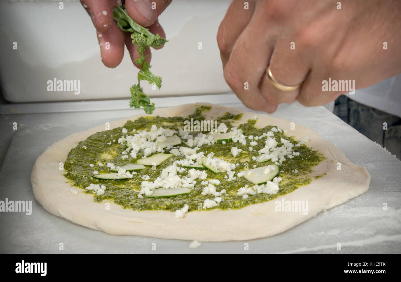 Timber Pizza Company's Jason Kellogg throws the dough high inside a U.S ...