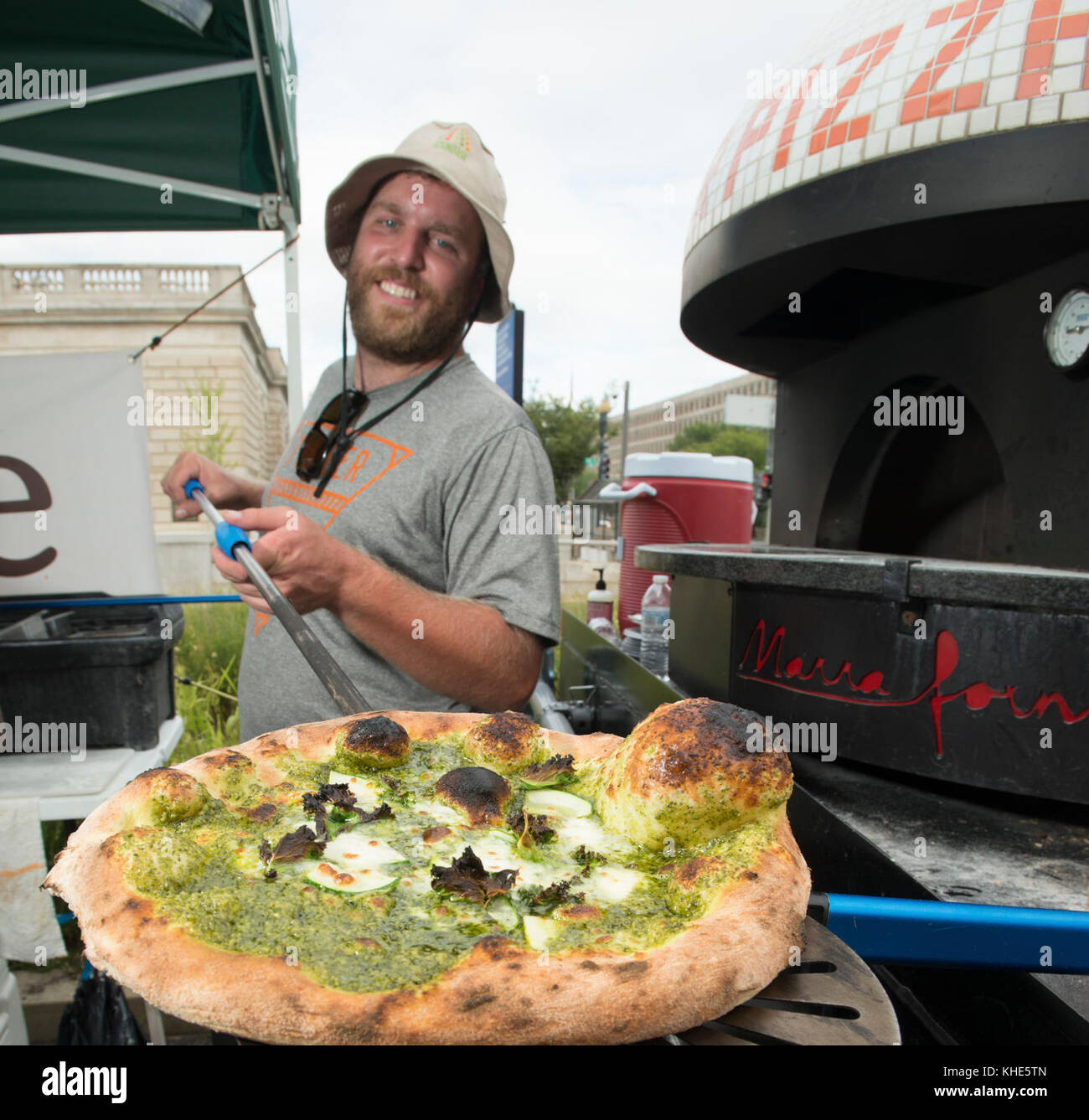 Timber Pizza Company's Jason Kellogg throws the dough high inside a U.S ...