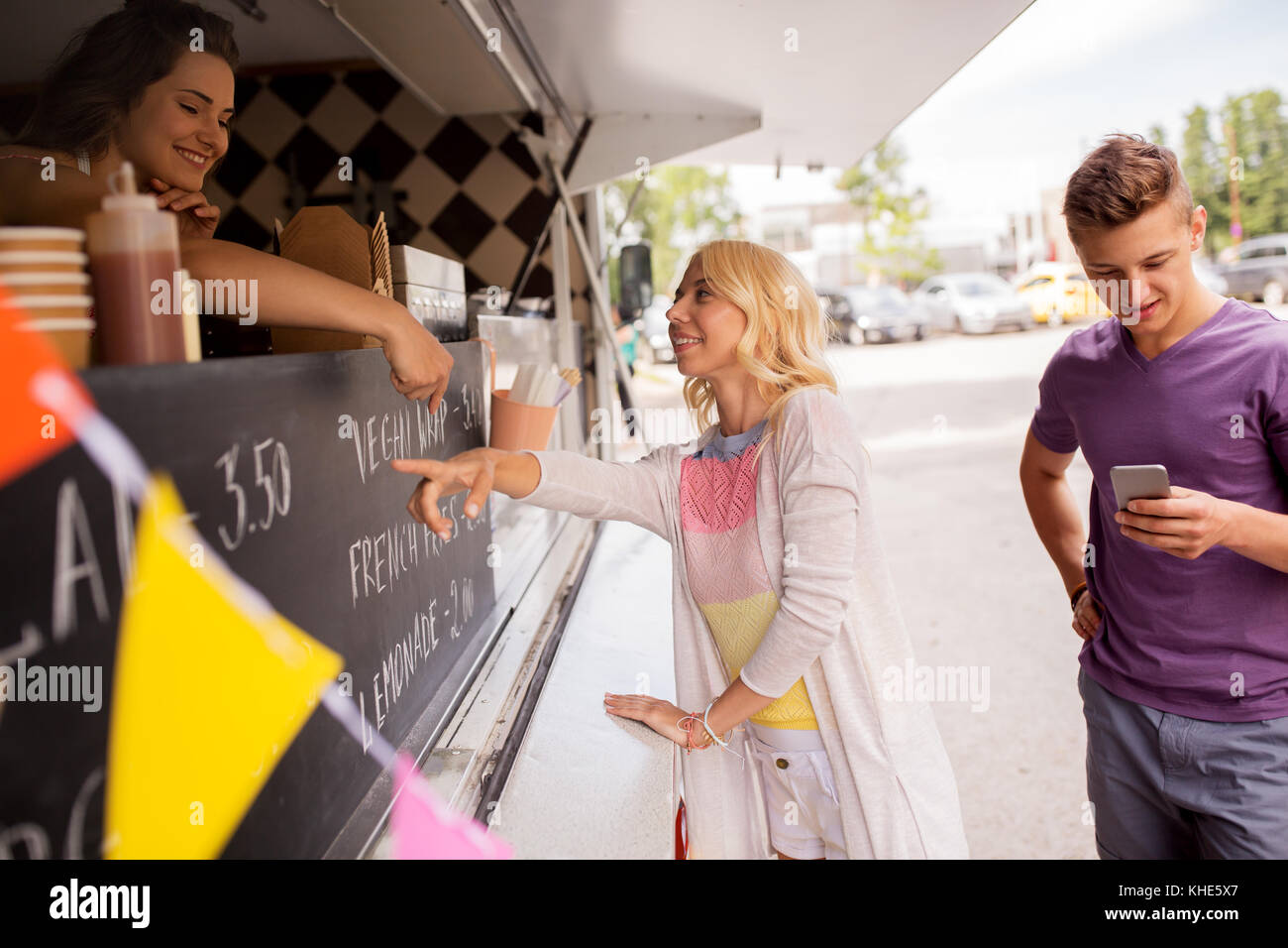 happy customers queue at food truck Stock Photo - Alamy