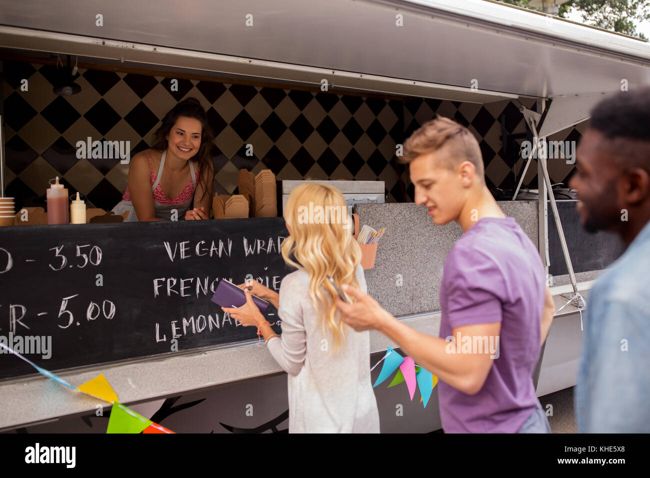 happy customers queue at food truck Stock Photo - Alamy