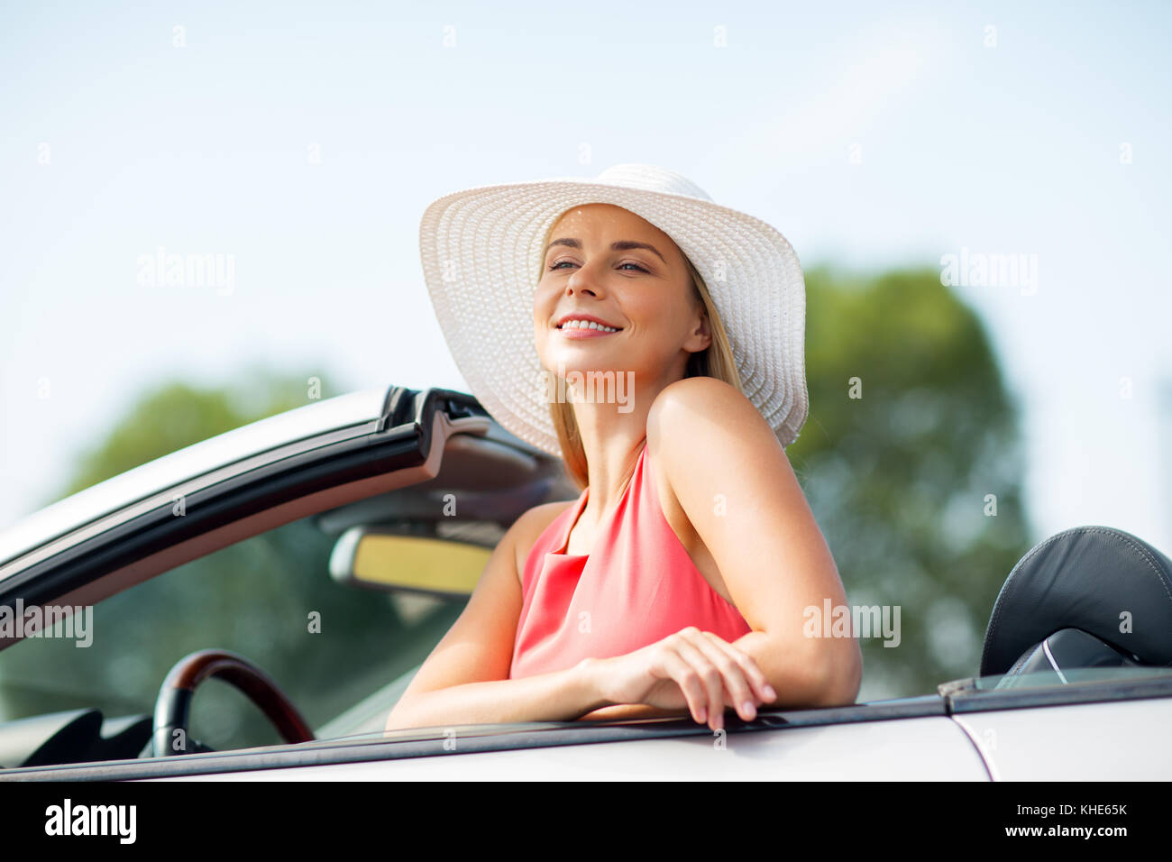 happy young woman in convertible car Stock Photo - Alamy