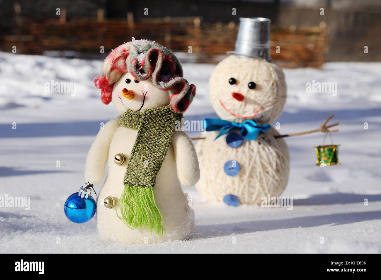 Two snowmen on snow background Stock Photo - Alamy