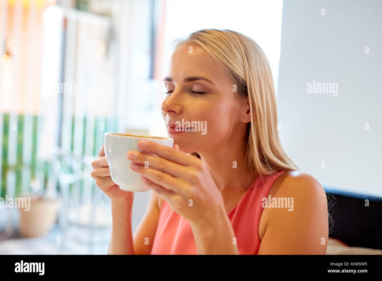 close up of woman drinking coffee at restaurant Stock Photo - Alamy