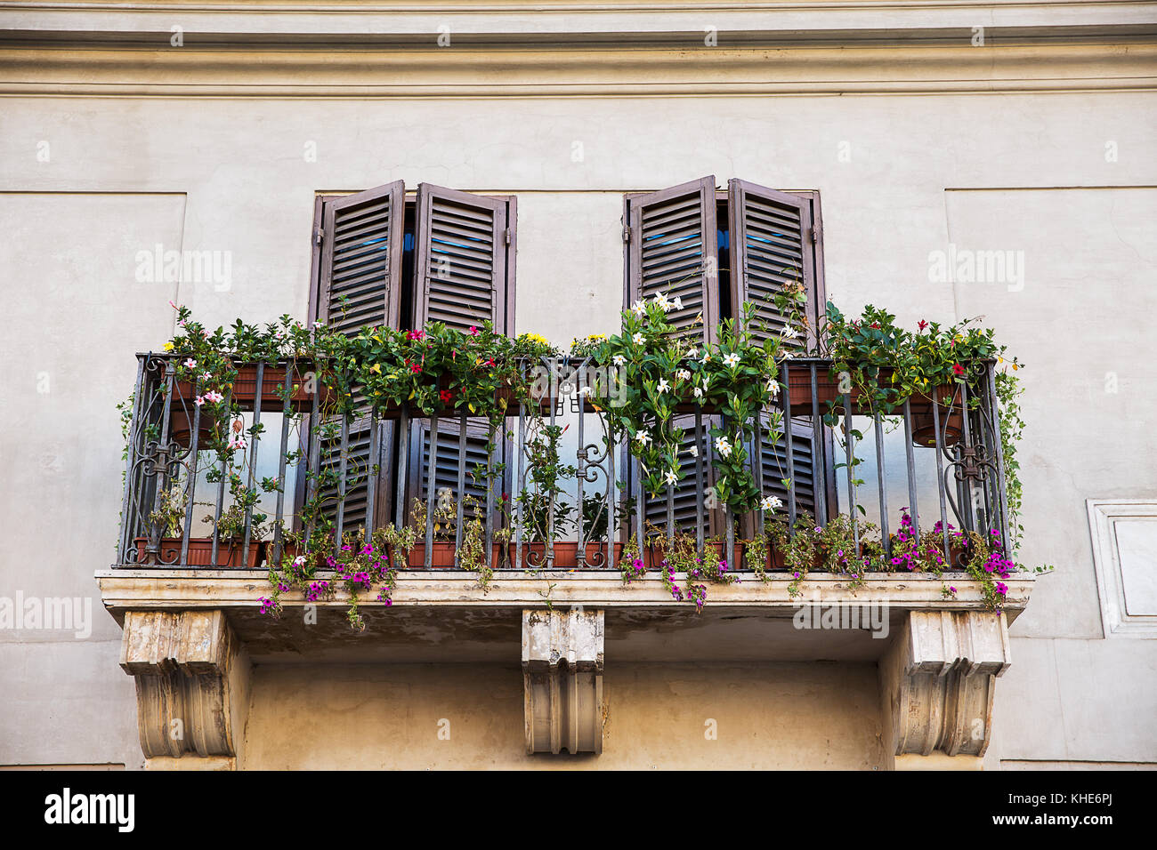 Rome , Italy . Beautiful balcony and windows decorated with flowers ...