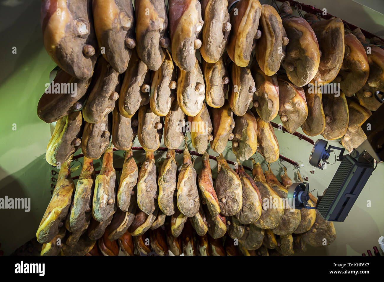 Pieces of a hamon hanging from the ceiling in the store Stock Photo - Alamy