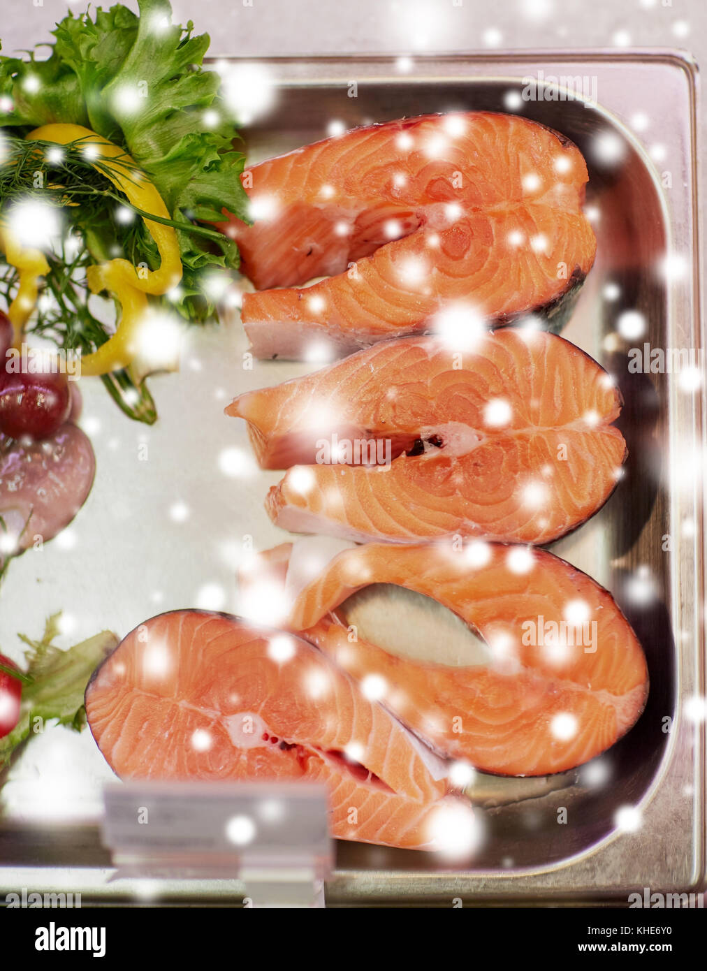 salmon fish fillet in metal tray on ice at grocery Stock Photo - Alamy