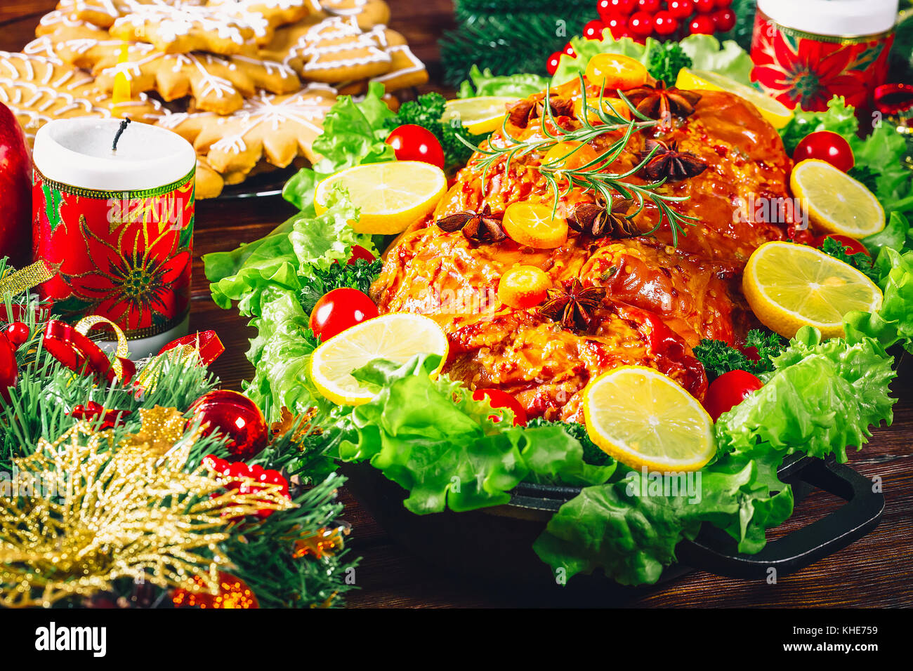 Christmas table dinner time with roasted meats, candles and New Year ...