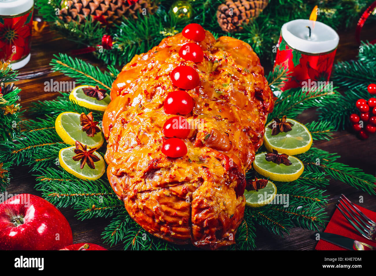 Christmas table dinner time with roasted meats, candles and New Year ...