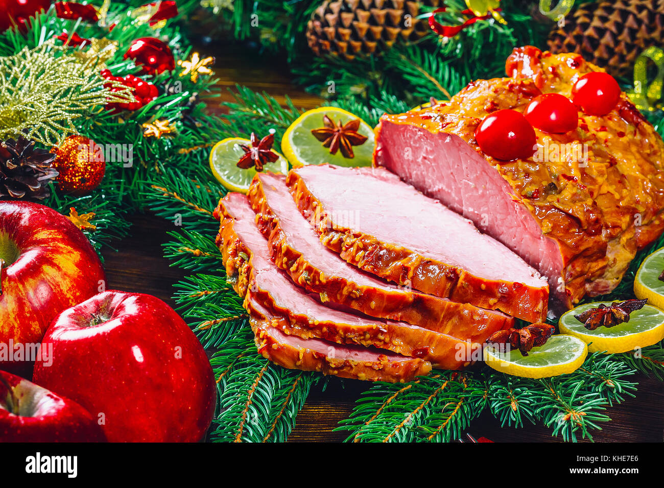 Christmas table dinner time with roasted meats, candles and New Year ...