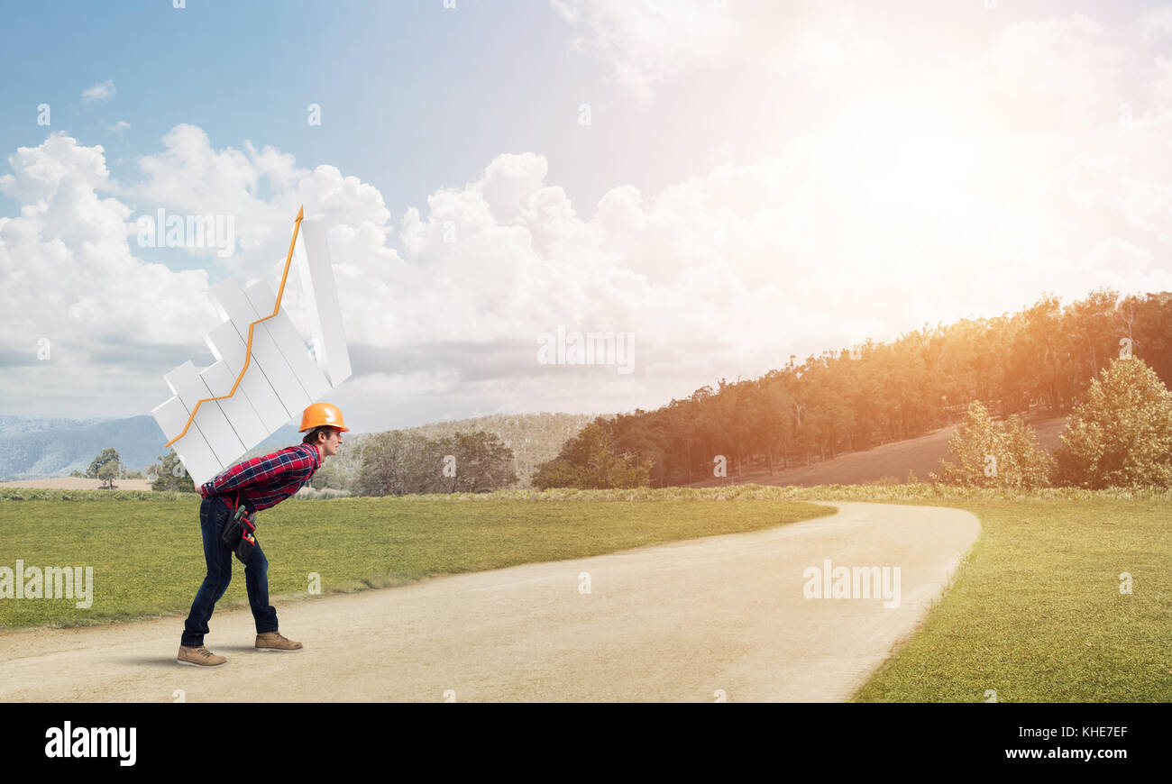 Engineer man carry progress graph Stock Photo - Alamy