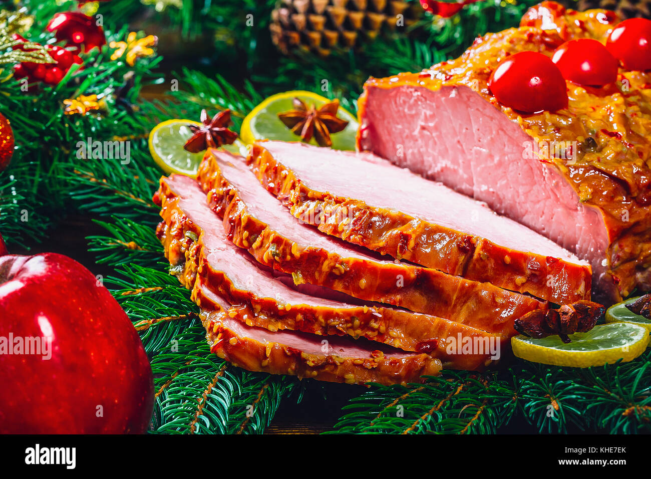 Christmas table dinner time with roasted meats, candles and New Year ...
