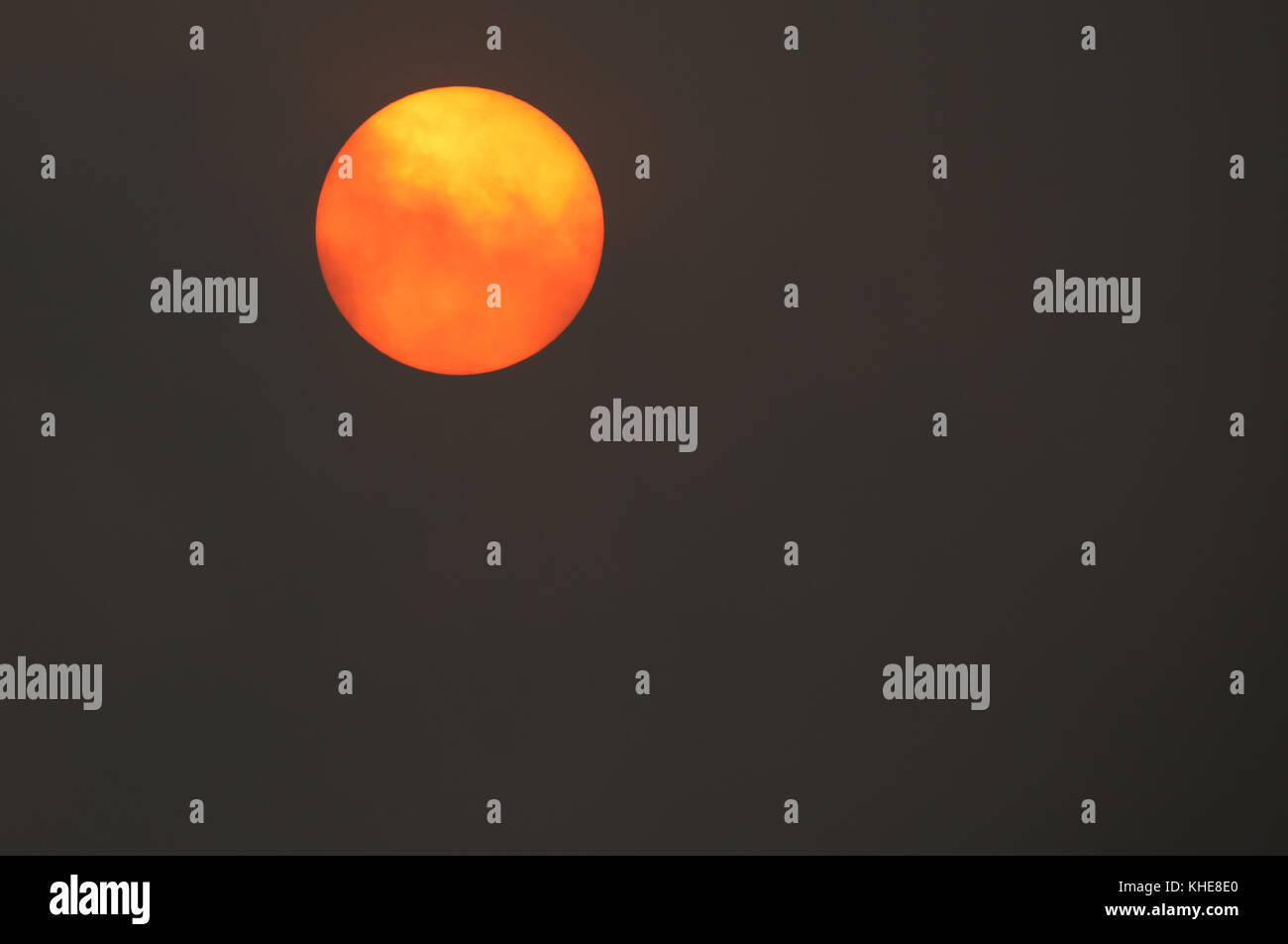 Red sun over London. The red appearance was due to the remnants of ...