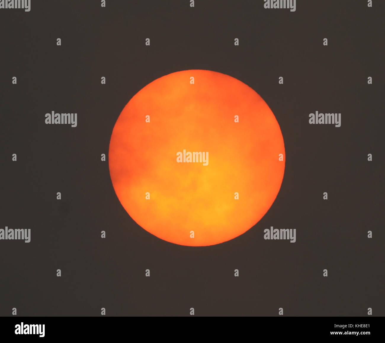 Red sun over London. The red appearance was due to the remnants of ...