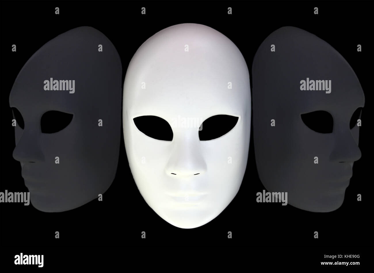 White mask with reflection on black background Stock Photo - Alamy