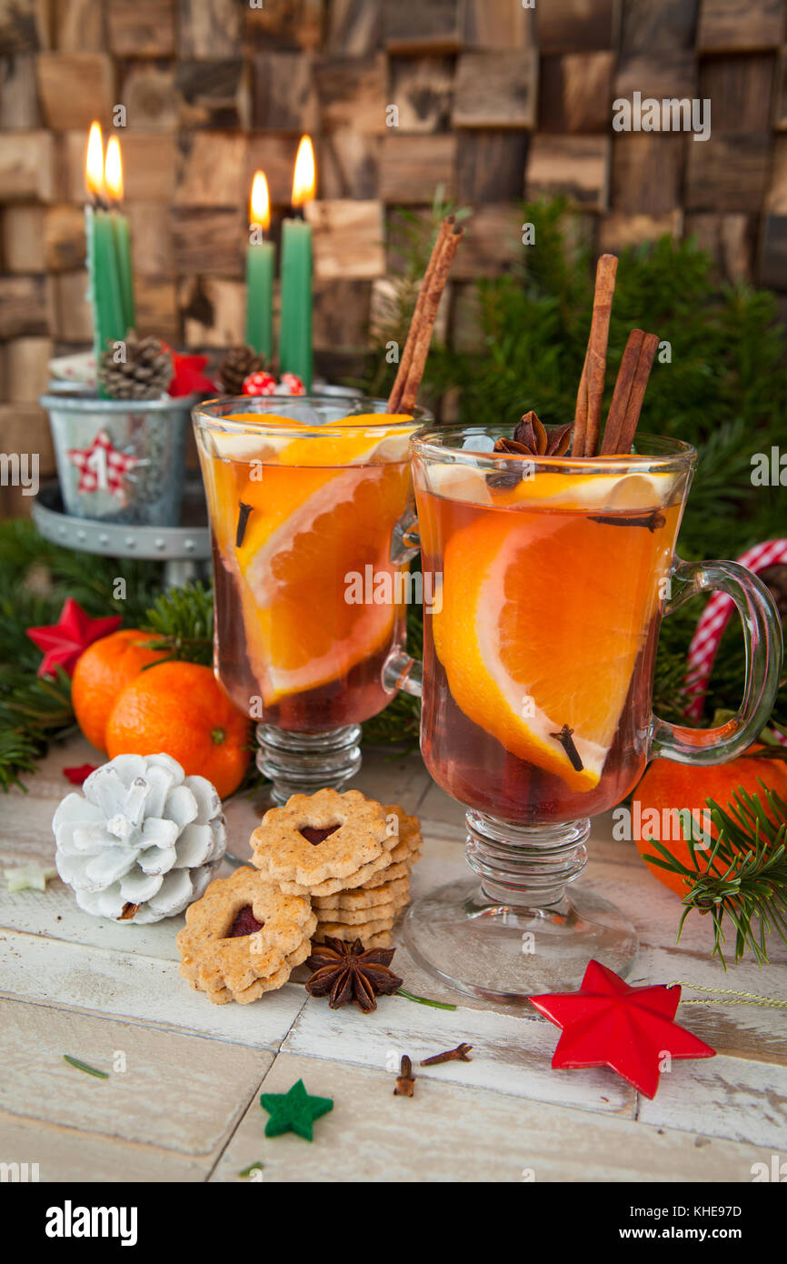 Hot spiced beverage with orange and cinnamon Stock Photo - Alamy