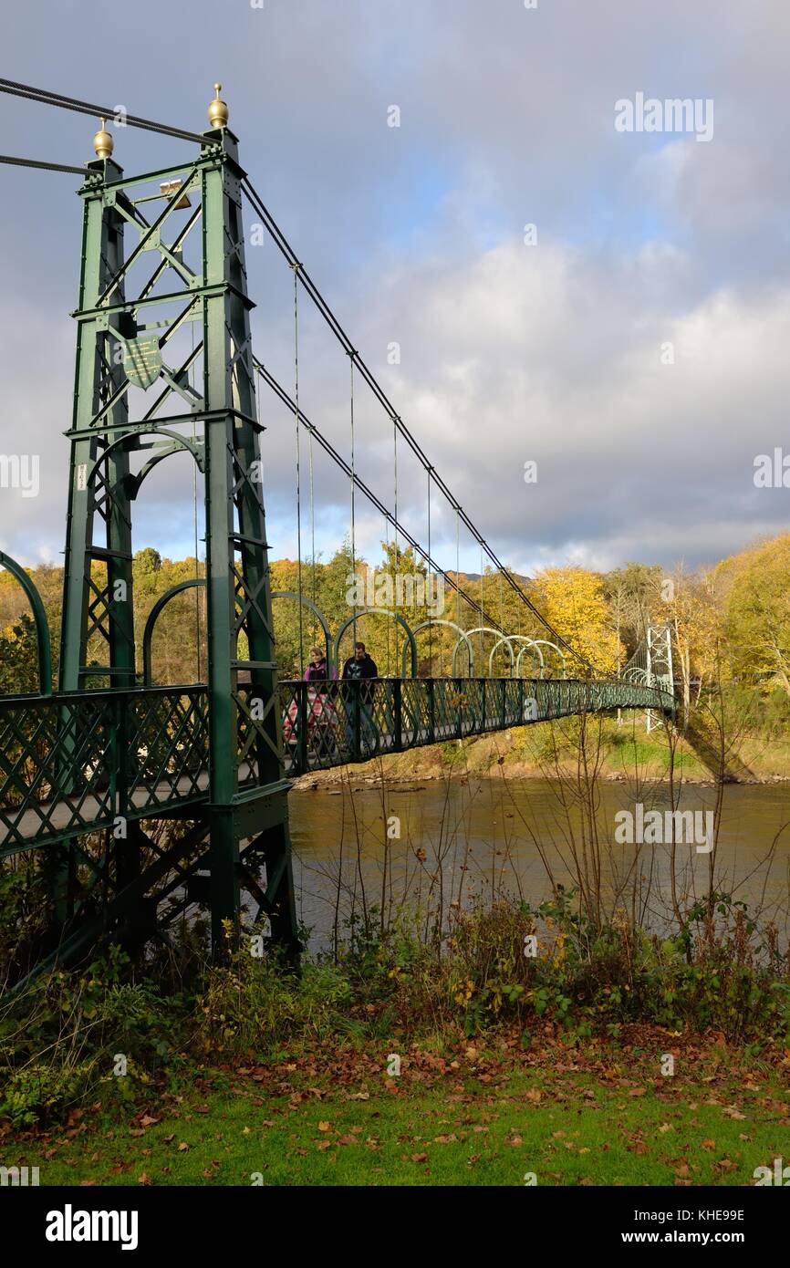 Victorian iron suspension bridge over the river Tummel in Pitlochry ...