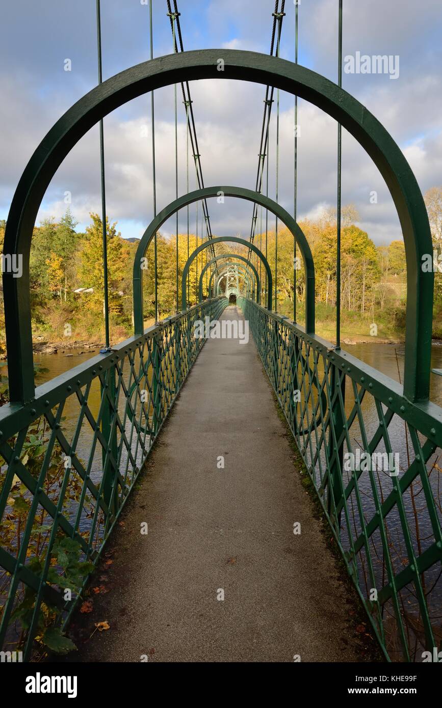 Victorian iron suspension bridge over the river Tummel in Pitlochry ...