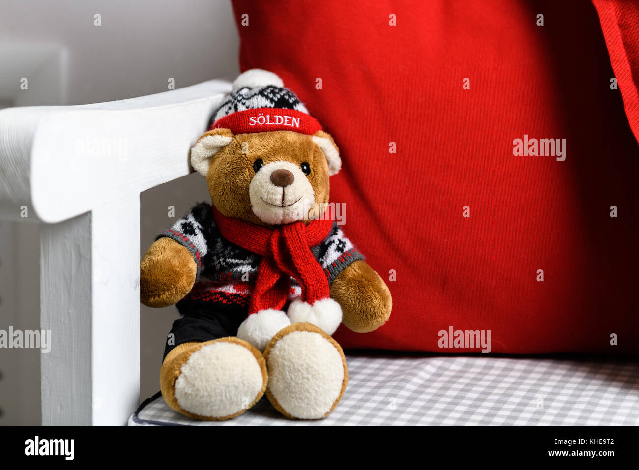 Teddy bear in a chair under the Christmas tree Stock Photo - Alamy