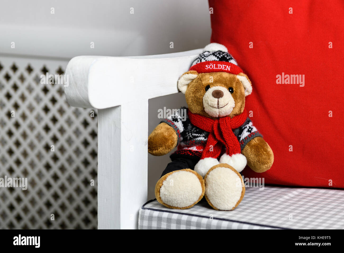 Teddy bear in a chair under the Christmas tree Stock Photo - Alamy